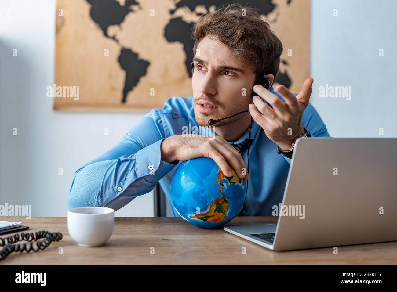 Serious travel agent touching hi-res stock photography and images - Alamy