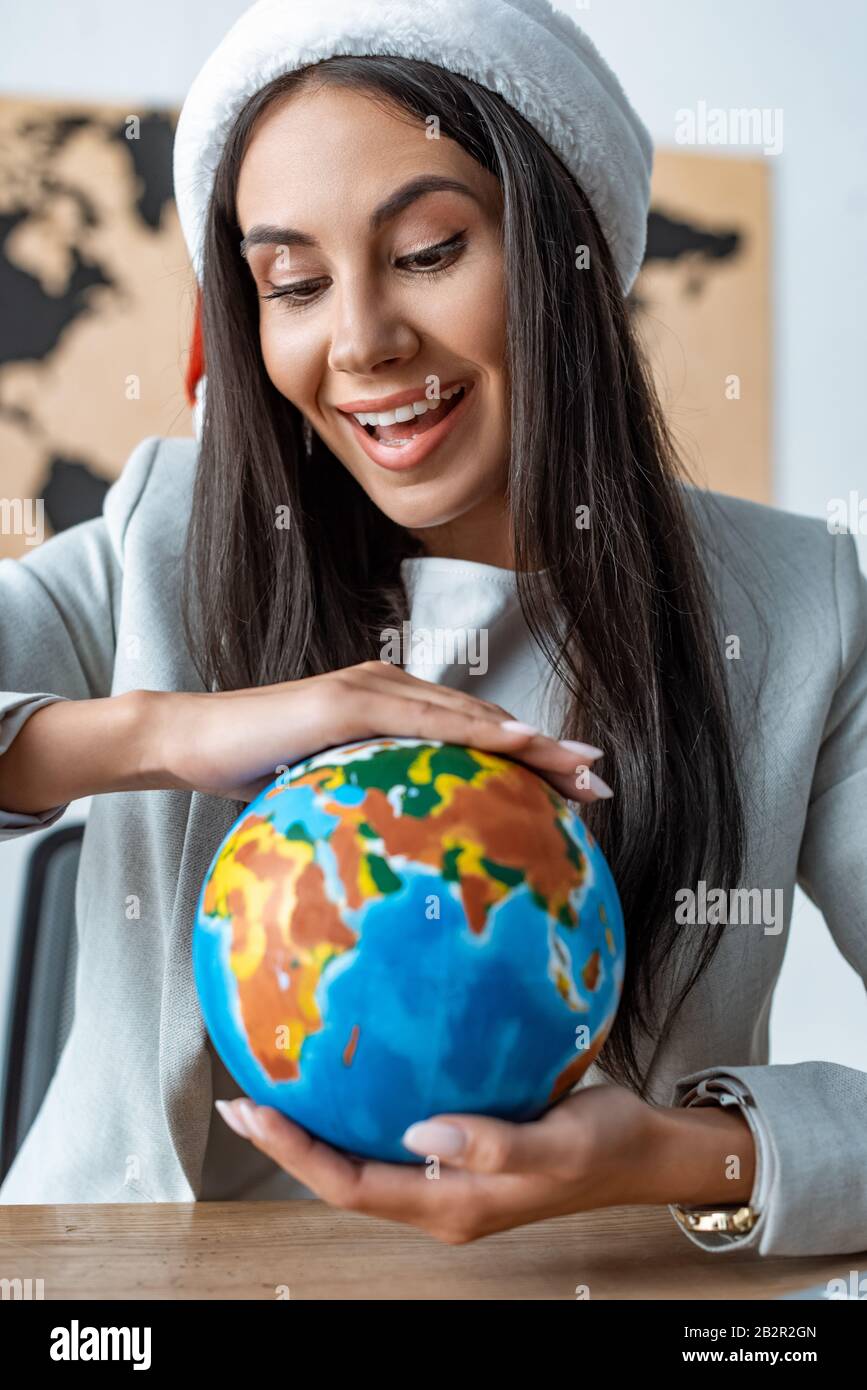 Santa holding globe hi-res stock photography and images - Alamy