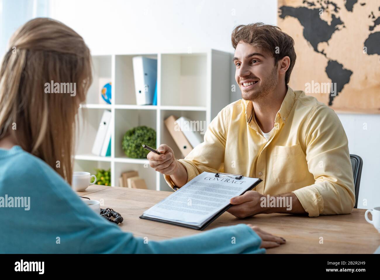 Businessman giving pen client hi-res stock photography and images - Alamy