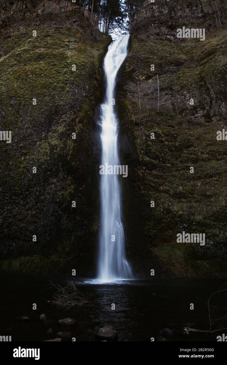 Wide shot of the waterfall in the middle of two cliffs in the Columbia ...