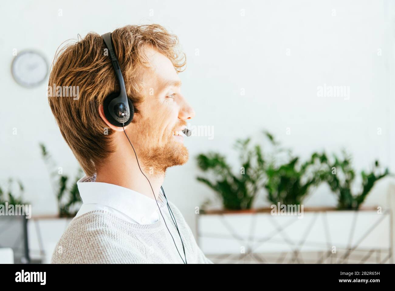Side view cheerful operator hi-res stock photography and images - Alamy