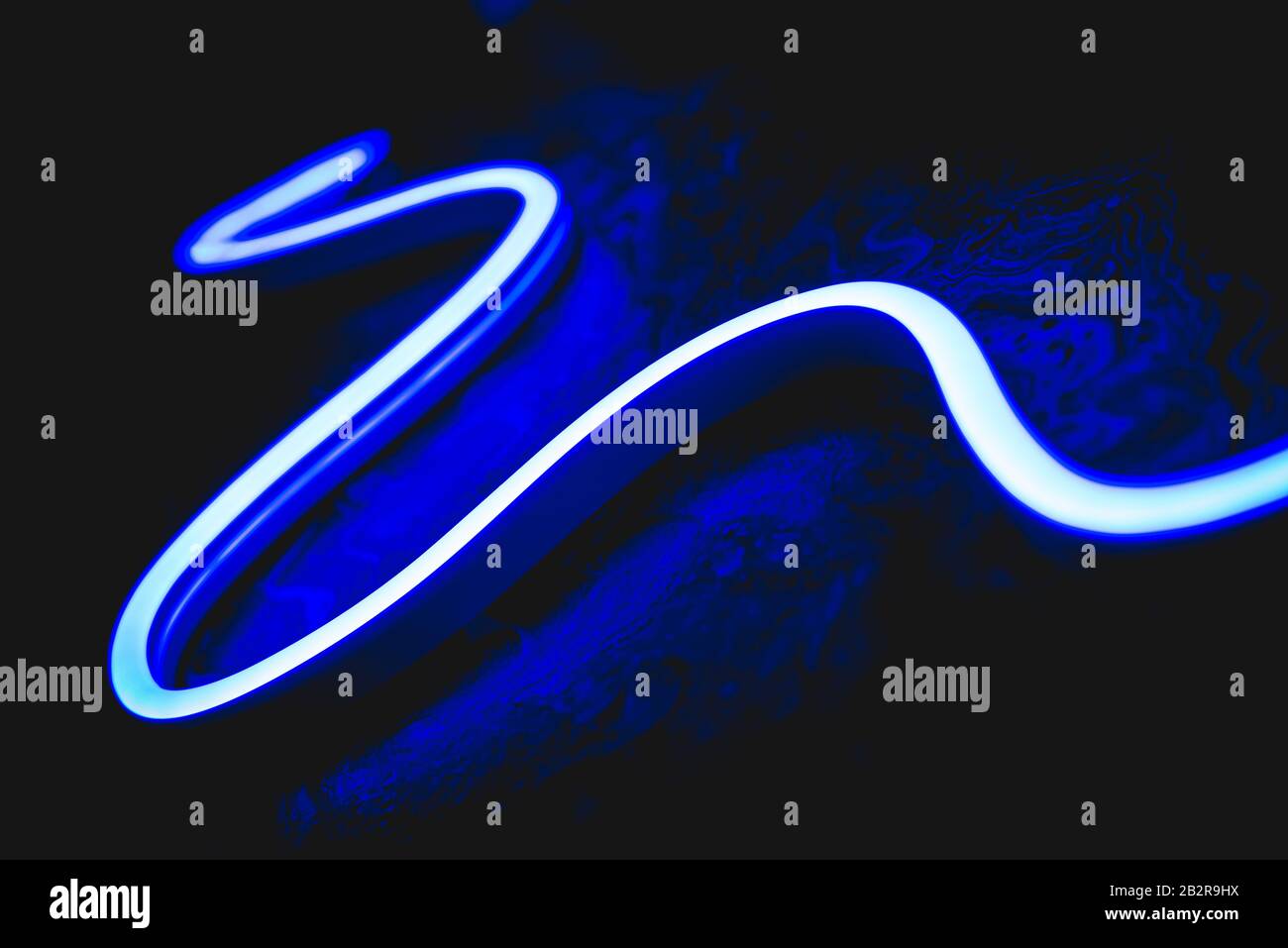 White and blue winding line of a neon laser light on a black background ...