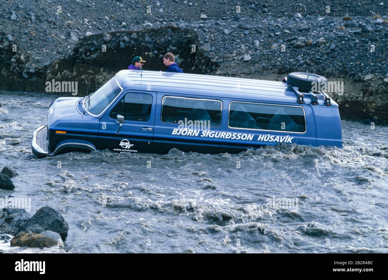 4x4 bus is stuck in a river during crossing, mountain track to ...