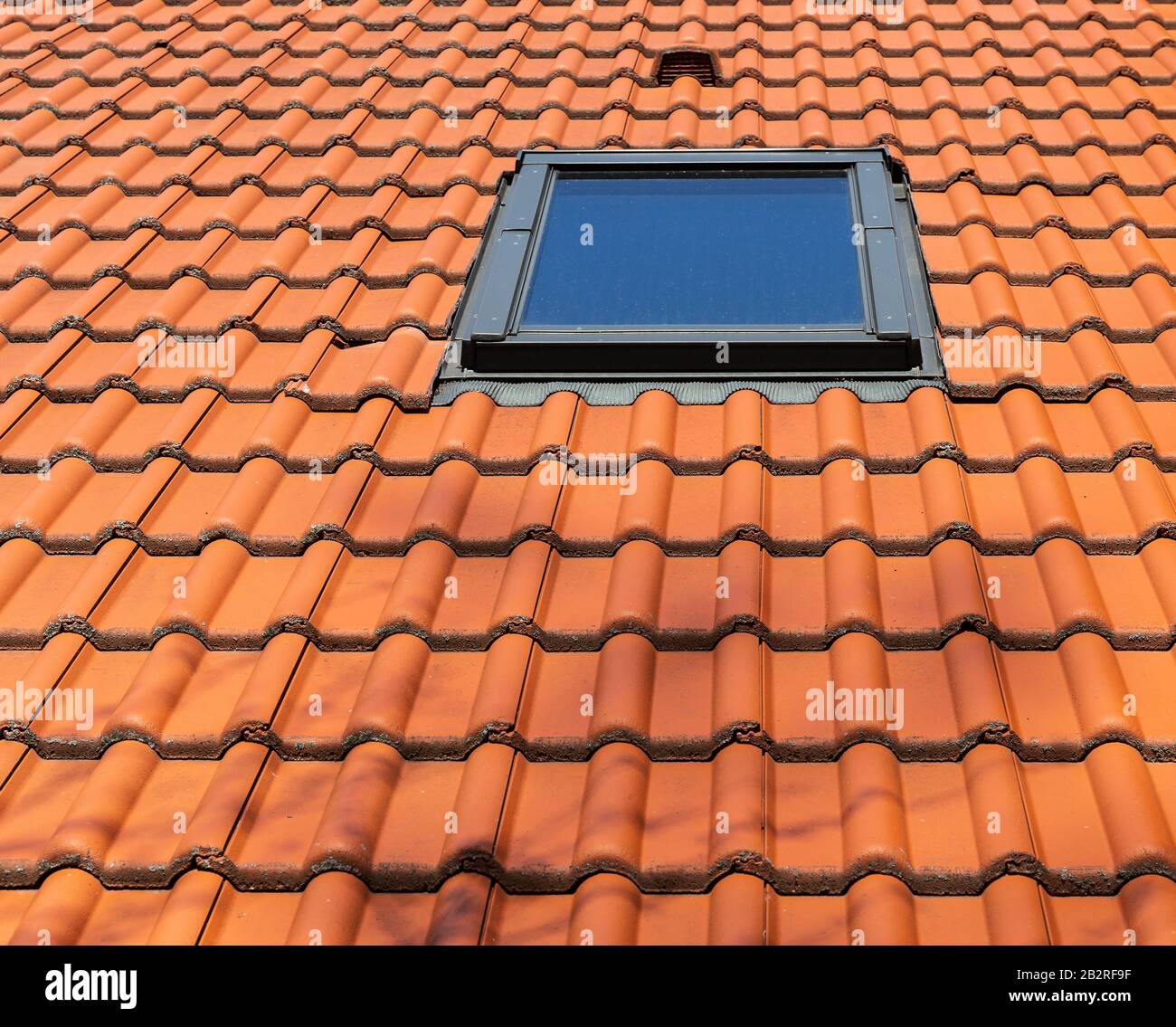 Tiled roof with attic window Stock Photo - Alamy