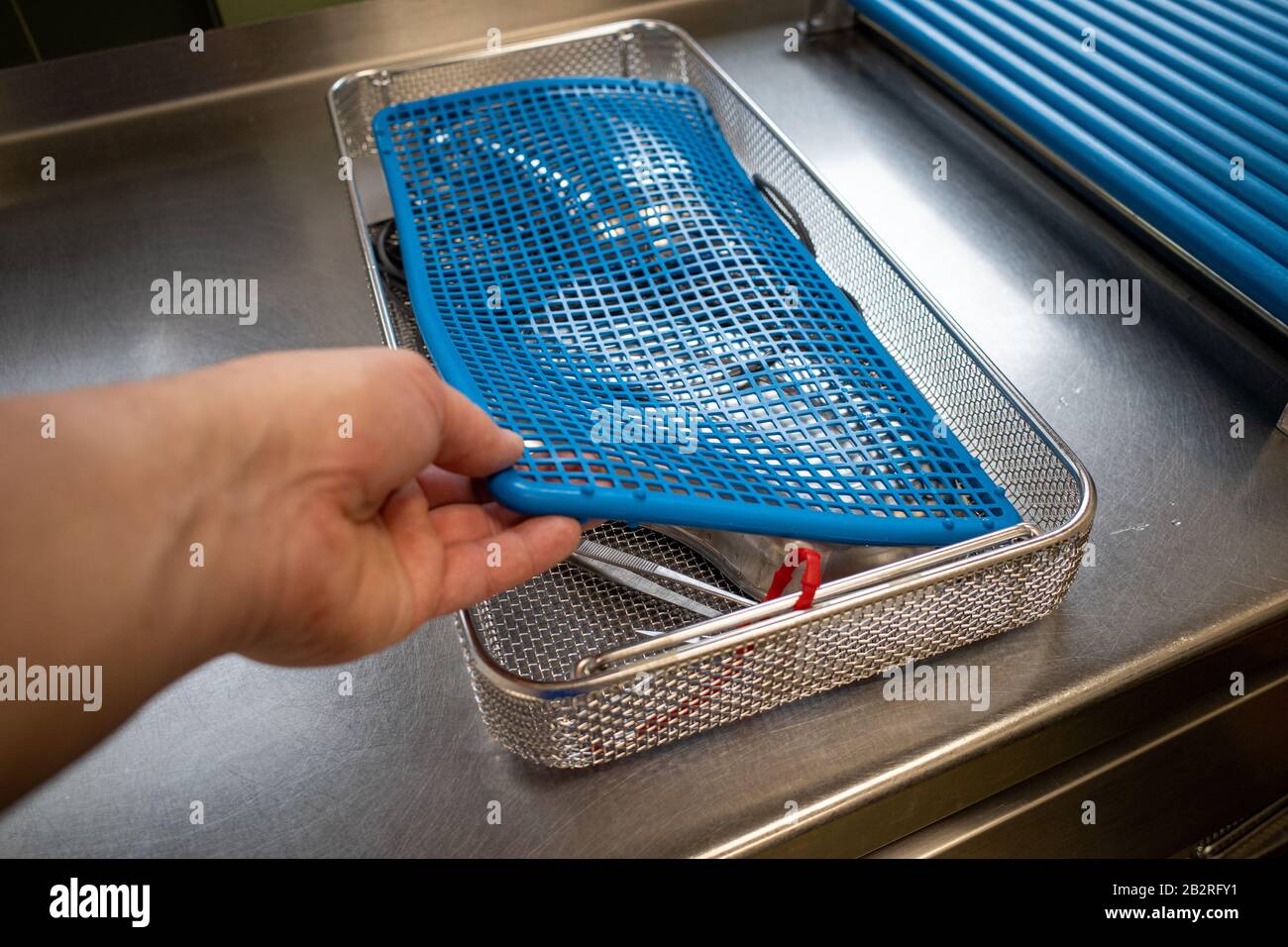 in an operating theatre there is an instrument tray with a protection ...