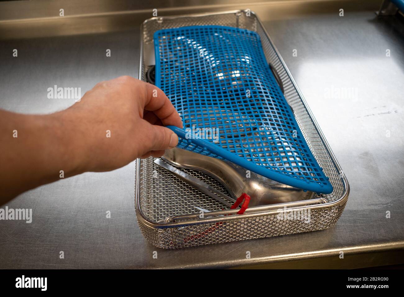 in an operating theatre there is an instrument tray with a protection ...