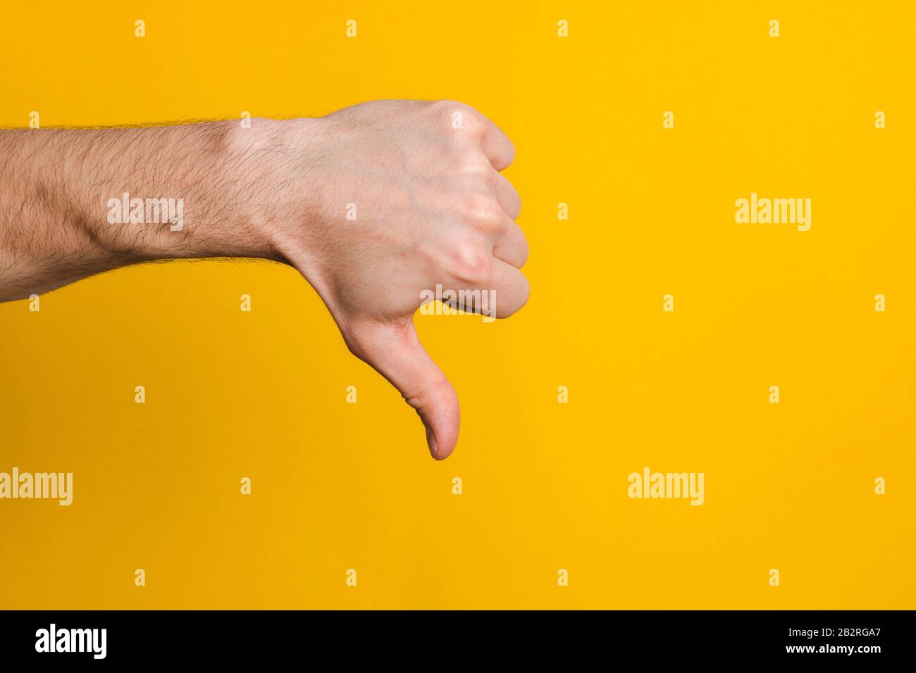 not good and not approved. close up hand of a man showing thumb down ...