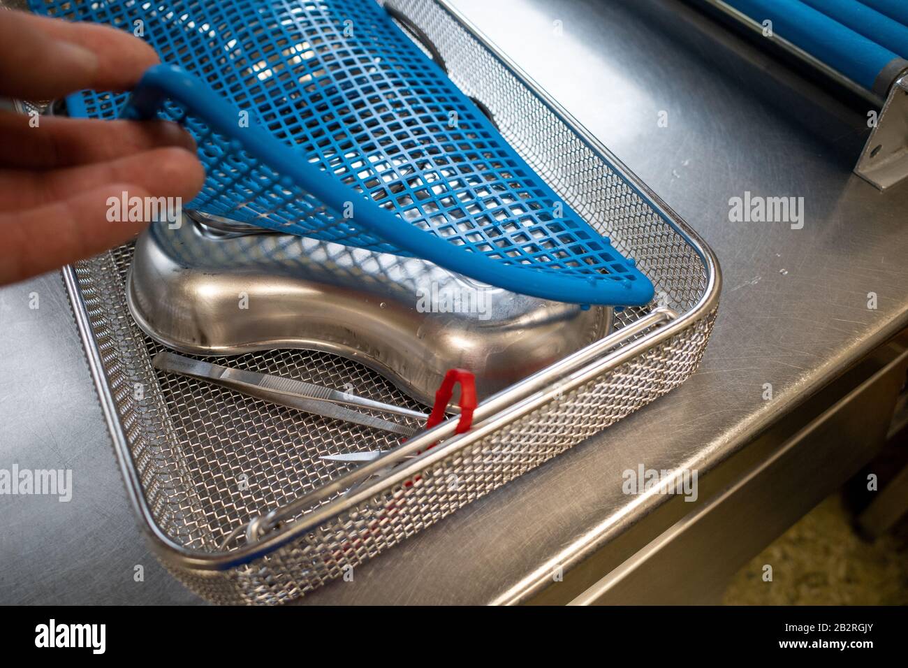 in an operating theatre there is an instrument tray with a protection ...