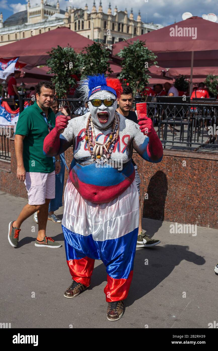 MOSCOW, RUSSIA - June 27, 2018: Russian football fan painted in colors ...