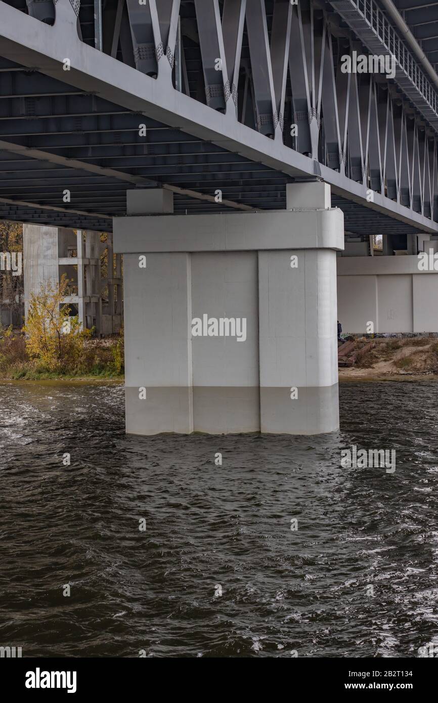 unfinished grey bridge in kyiv to river island. Bridge construction ...