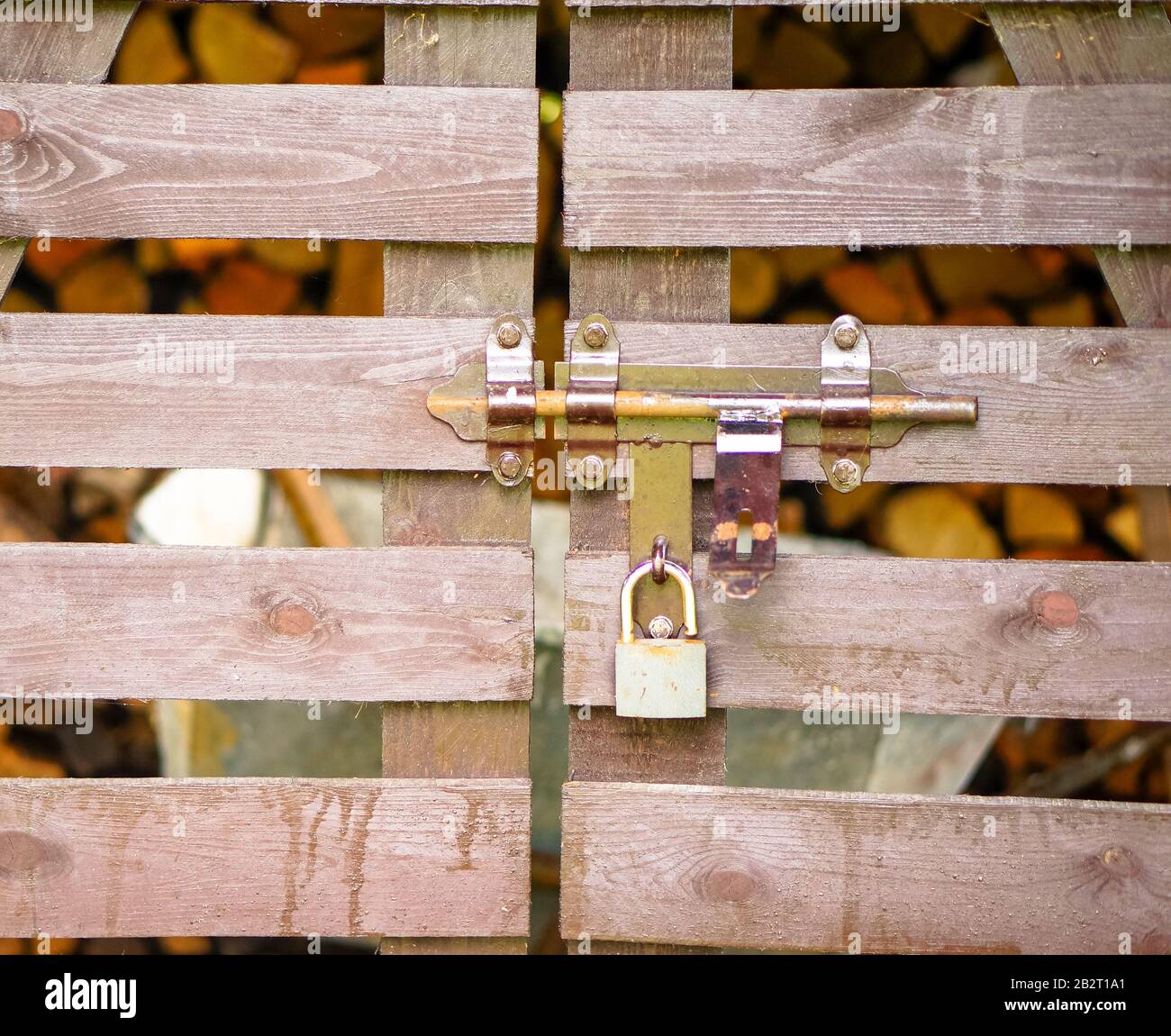 Wooden gate with a padlock Stock Photo - Alamy