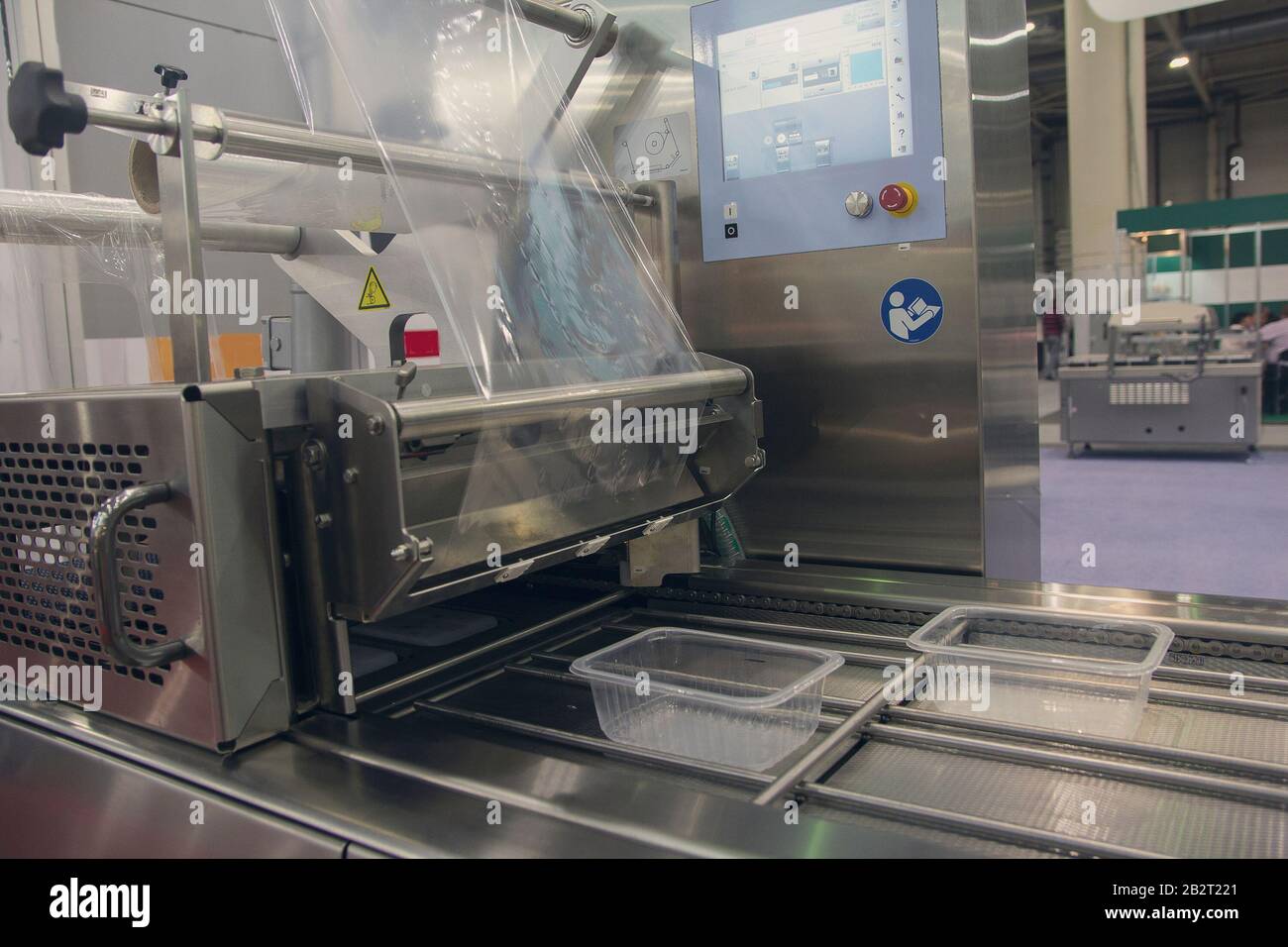 Machine for packing food products close-up. Industry Stock Photo - Alamy