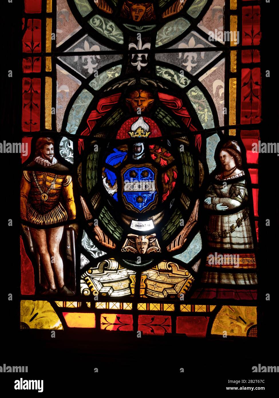 Colored soldered stained-glass windows through which the sun shines ...