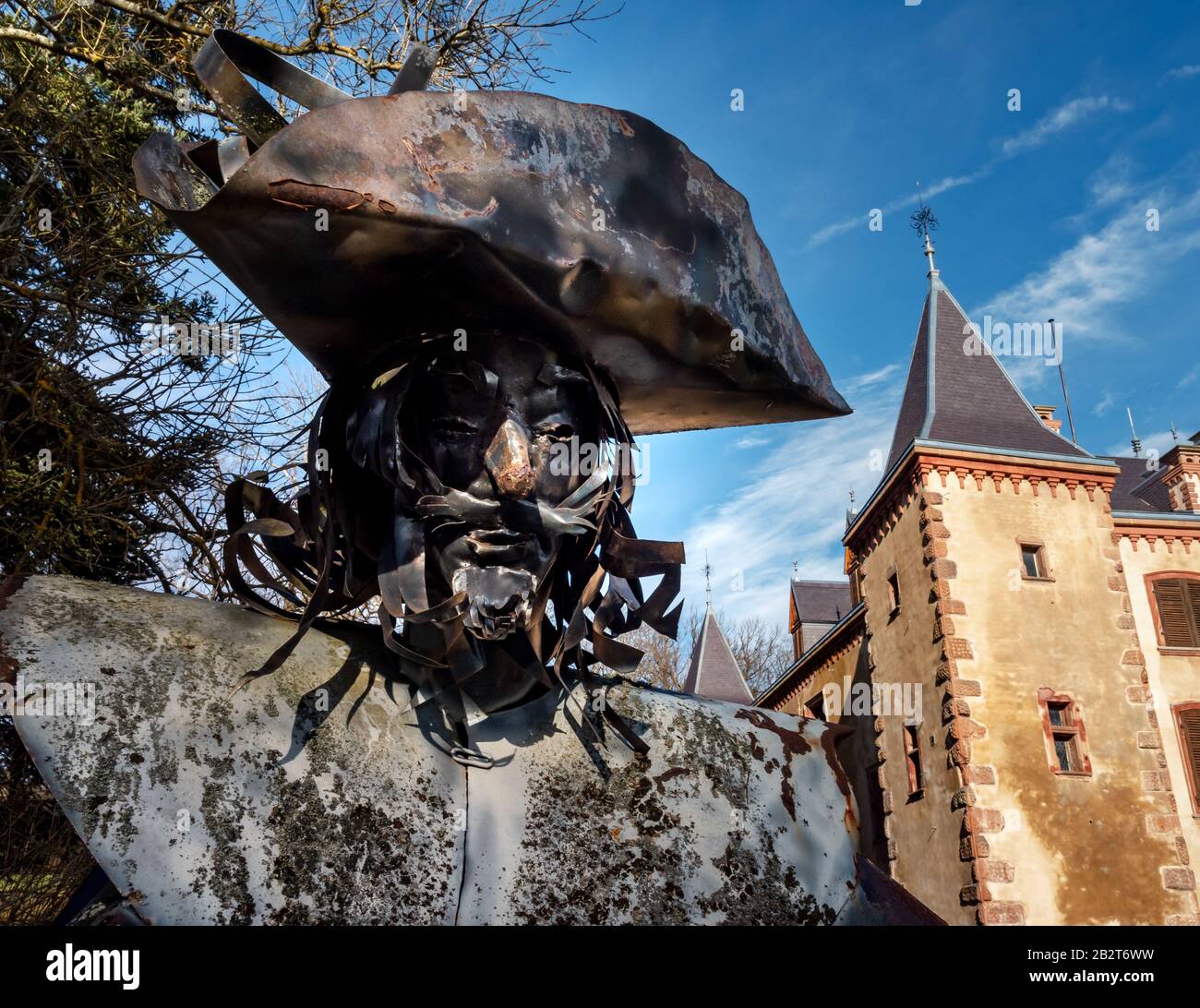 Iron statues of french musketeers on the background of an old castle ...