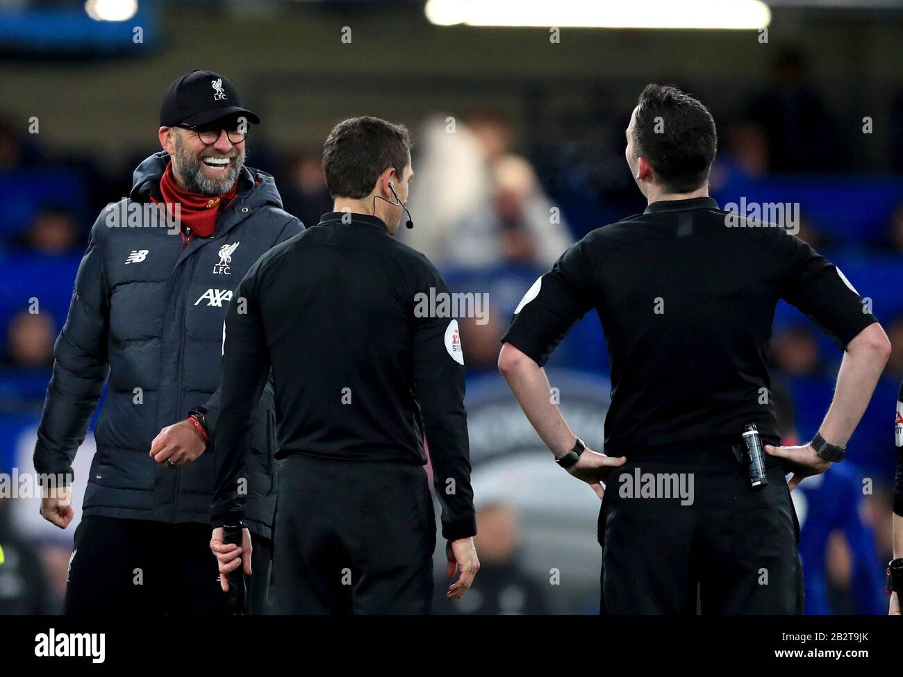Liverpool manager Jurgen Klopp (left) speaks to referee Chris Kavanagh ...