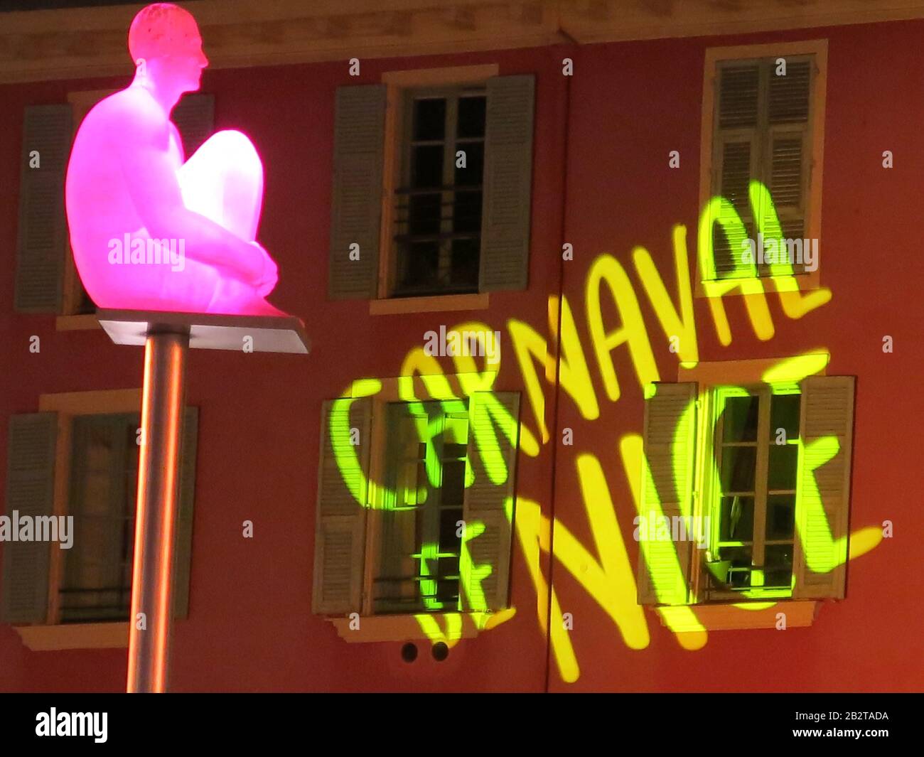 "Carnaval de Nice" is projected onto the façade of the buildings and ...
