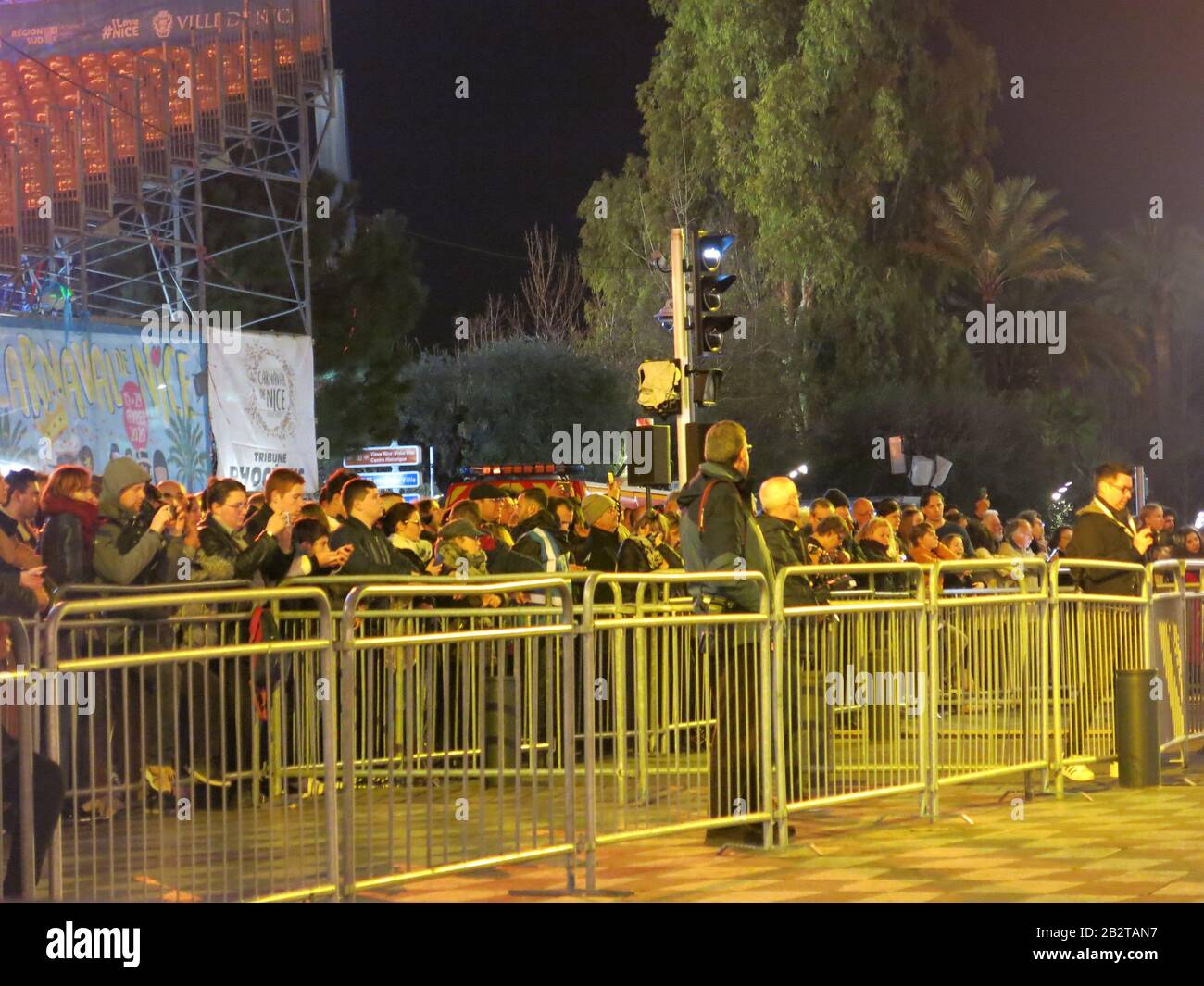 Crowds gather at the barriers in central Nice, waiting for the ...