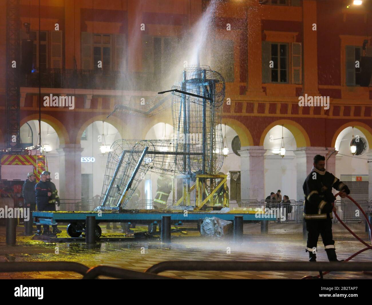 Firefighters are winding up their hoses after dousing the flames of the ...