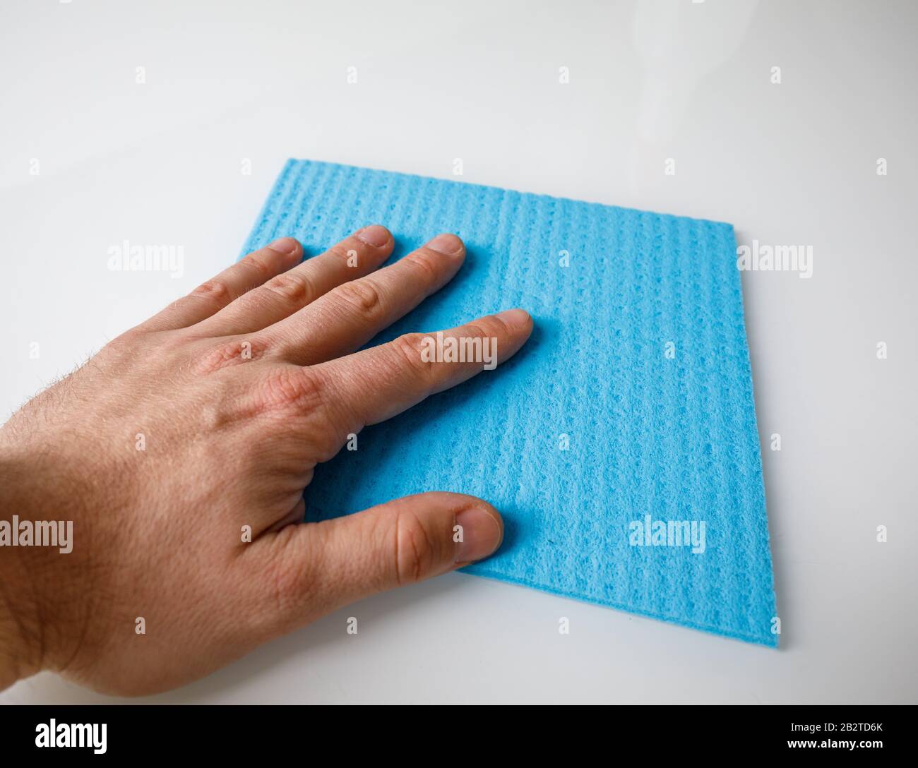 hand cleaning with blue sponge isolated on white background. Spring ...