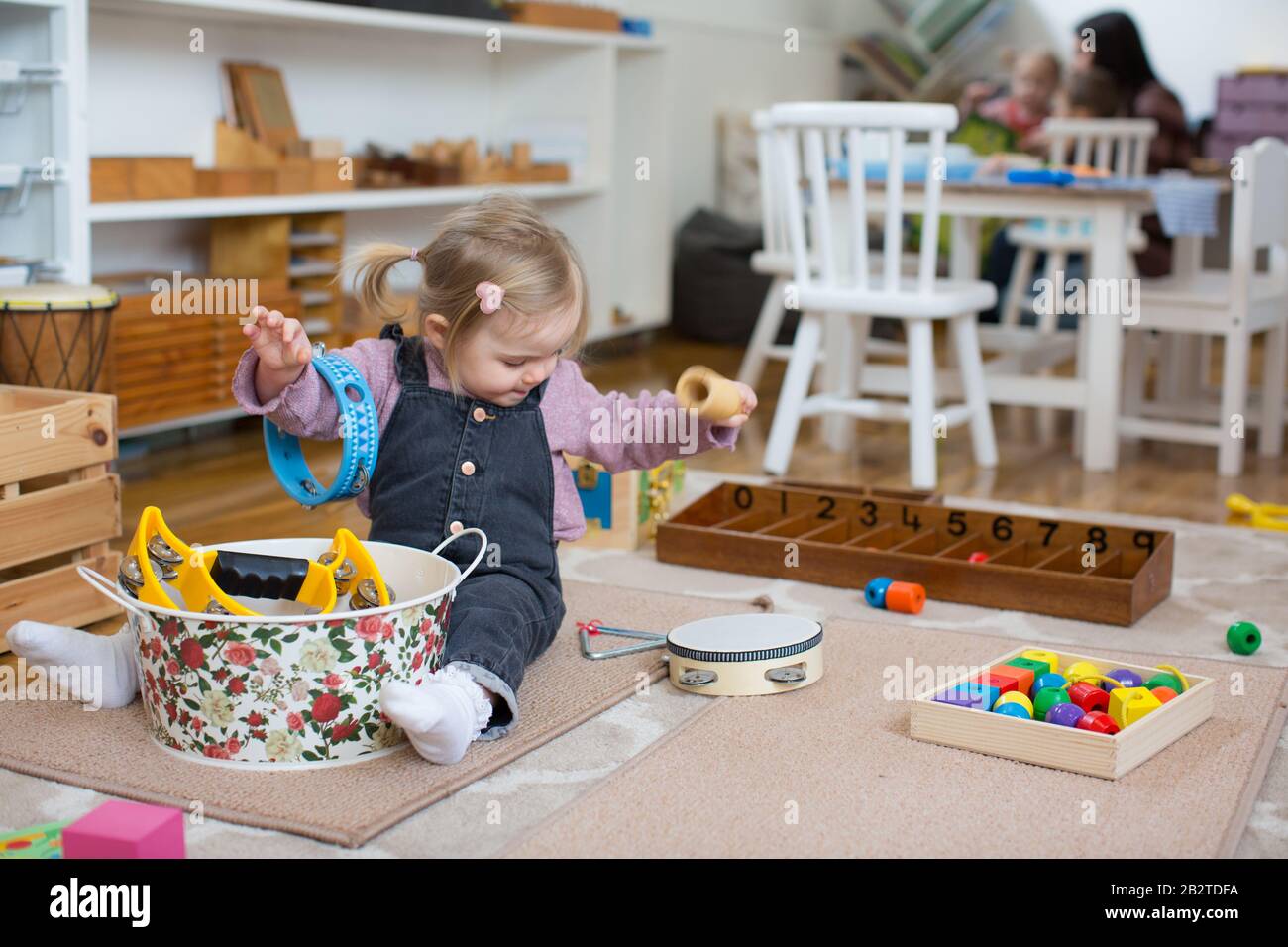Child tambourine hi-res stock photography and images - Alamy