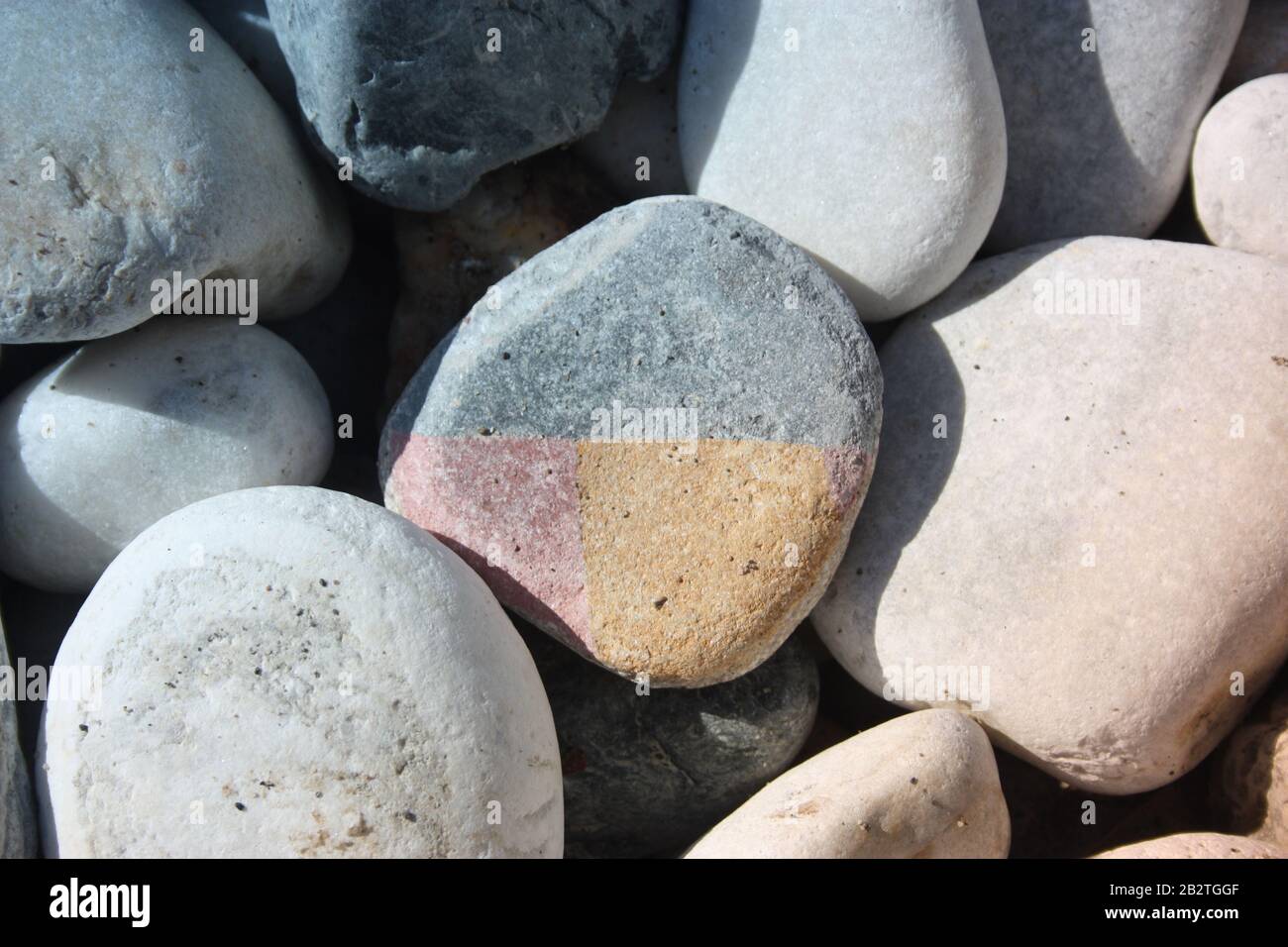 many round colored stones all equal to each other and in the middle a ...