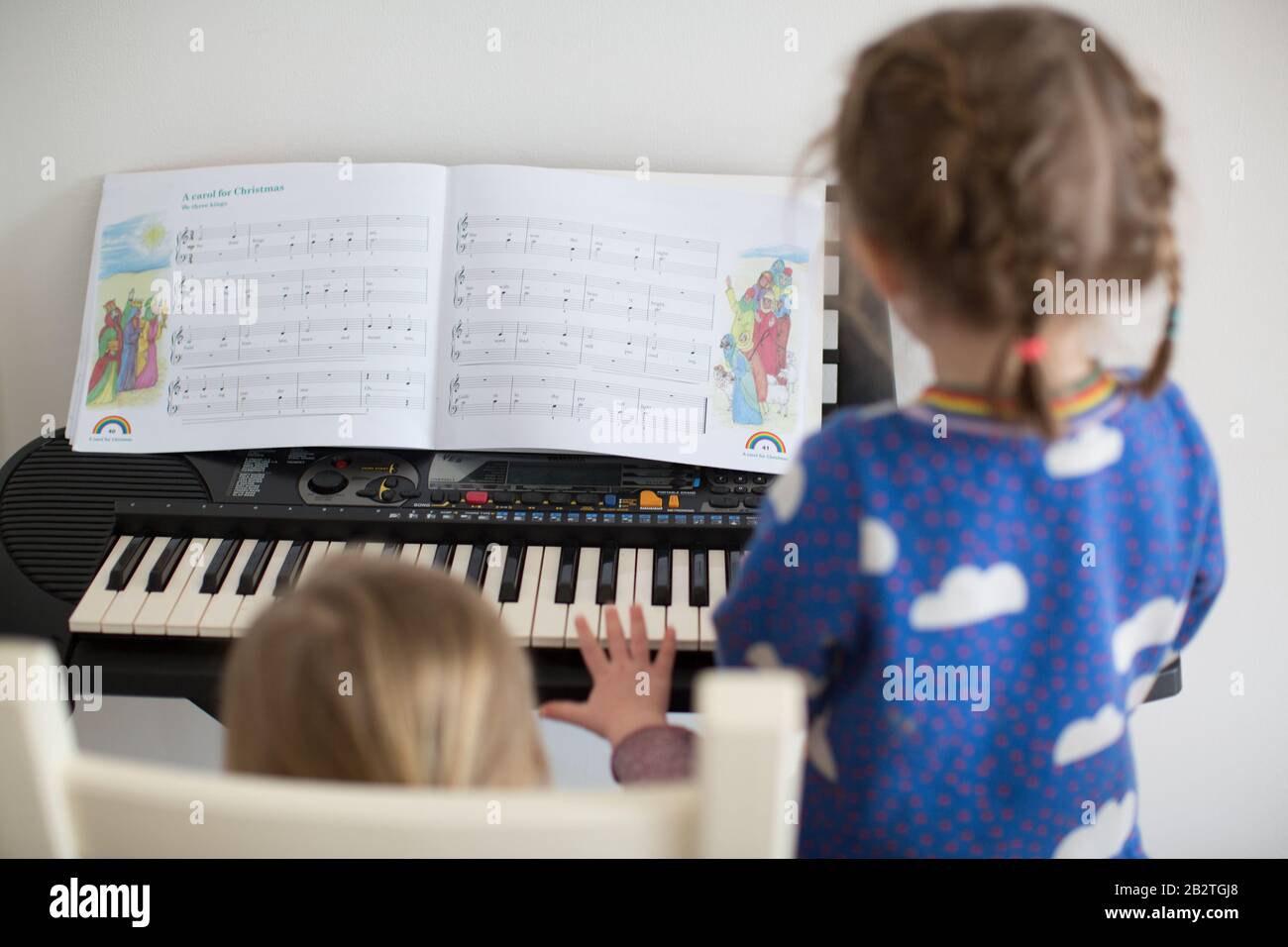 Children playing the keyboard Stock Photo - Alamy