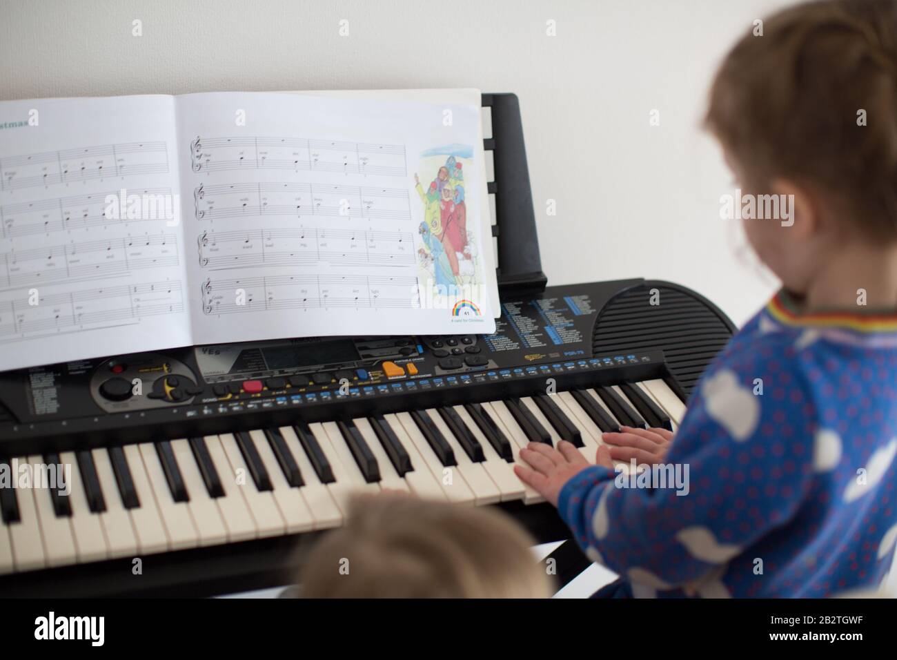 Children playing the keyboard Stock Photo - Alamy