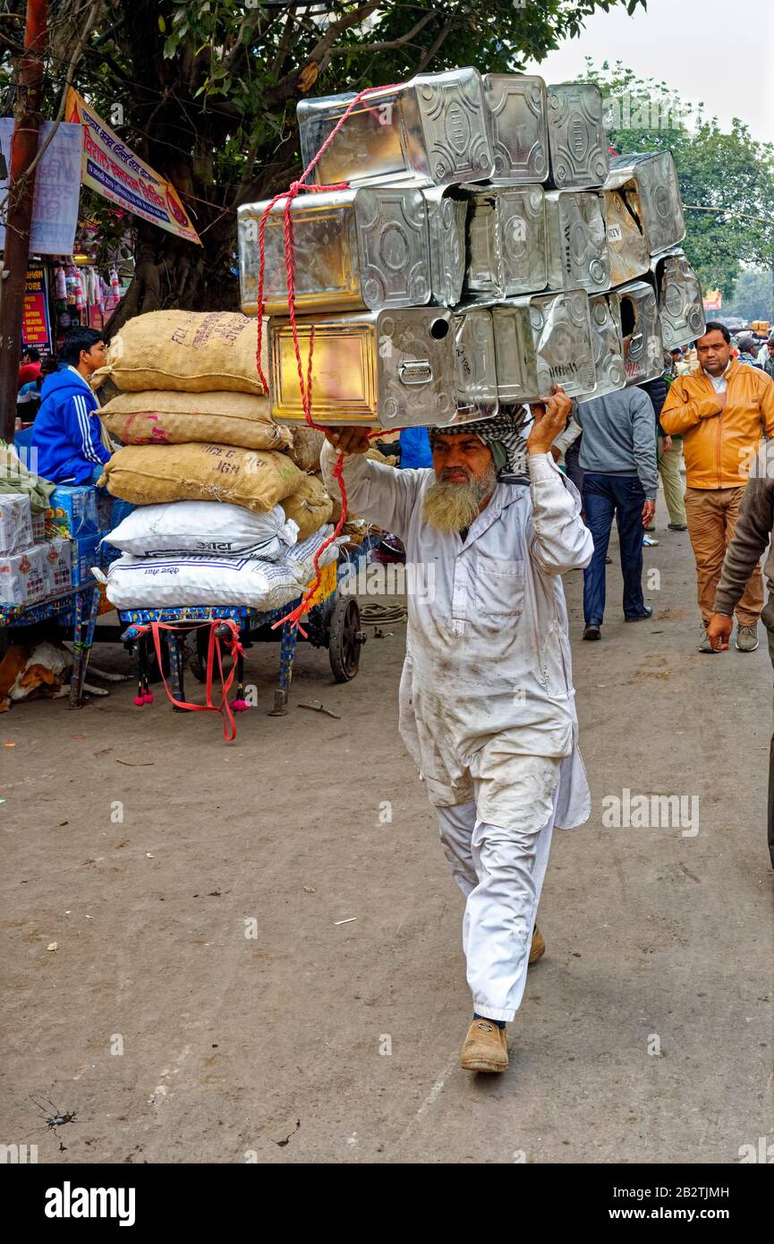 Man carrying cans on his head, Chandni Chowk bazaar, one of the oldest ...