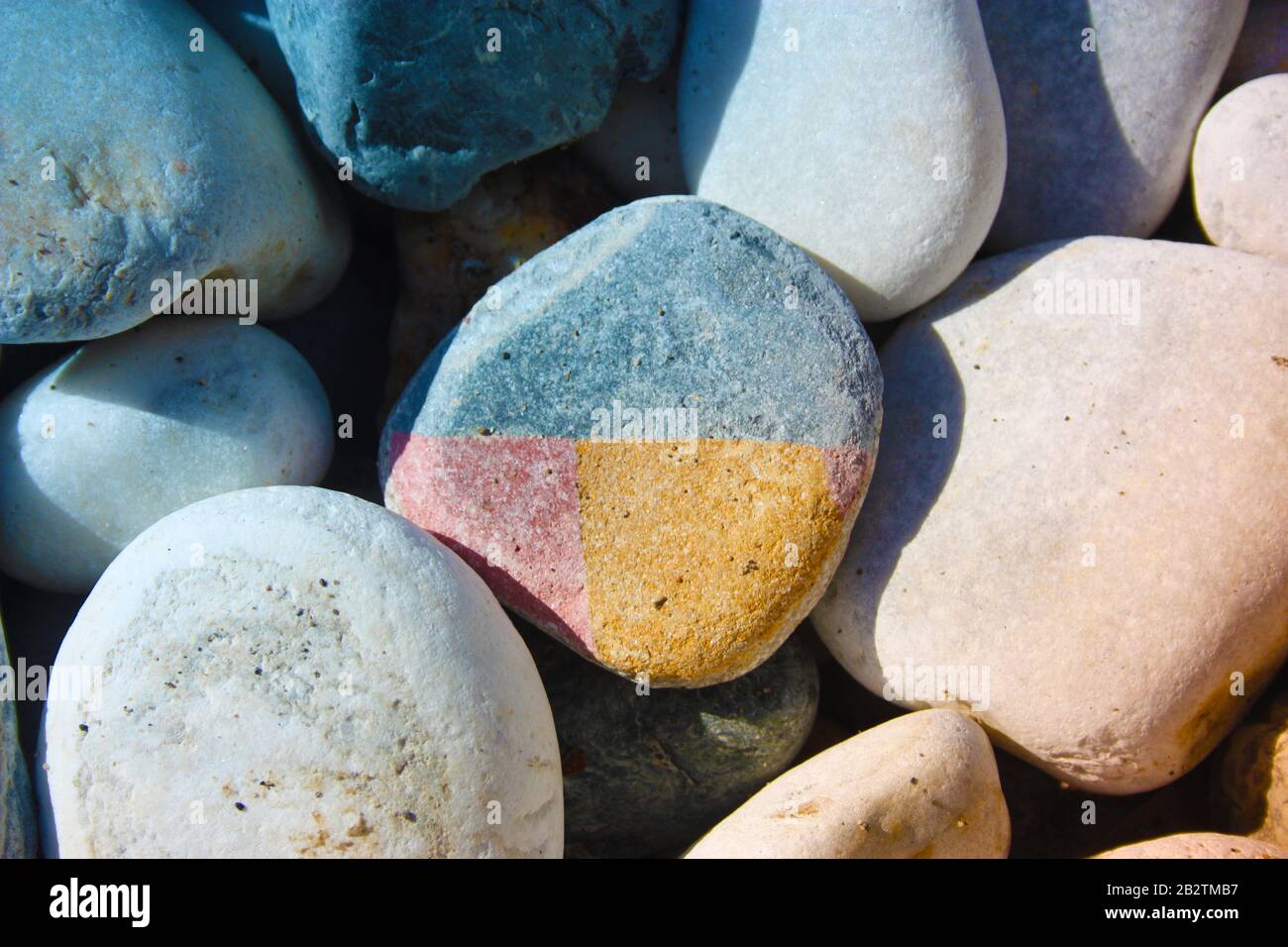 many round colored stones all equal to each other and in the middle a ...