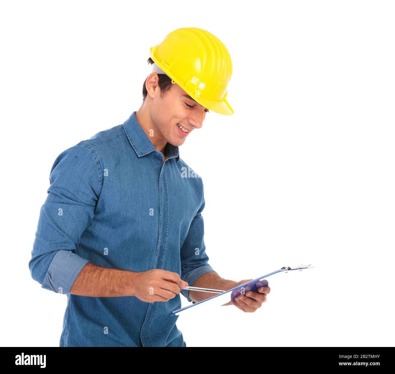 smiling construction engineering student reading his notes on a ...