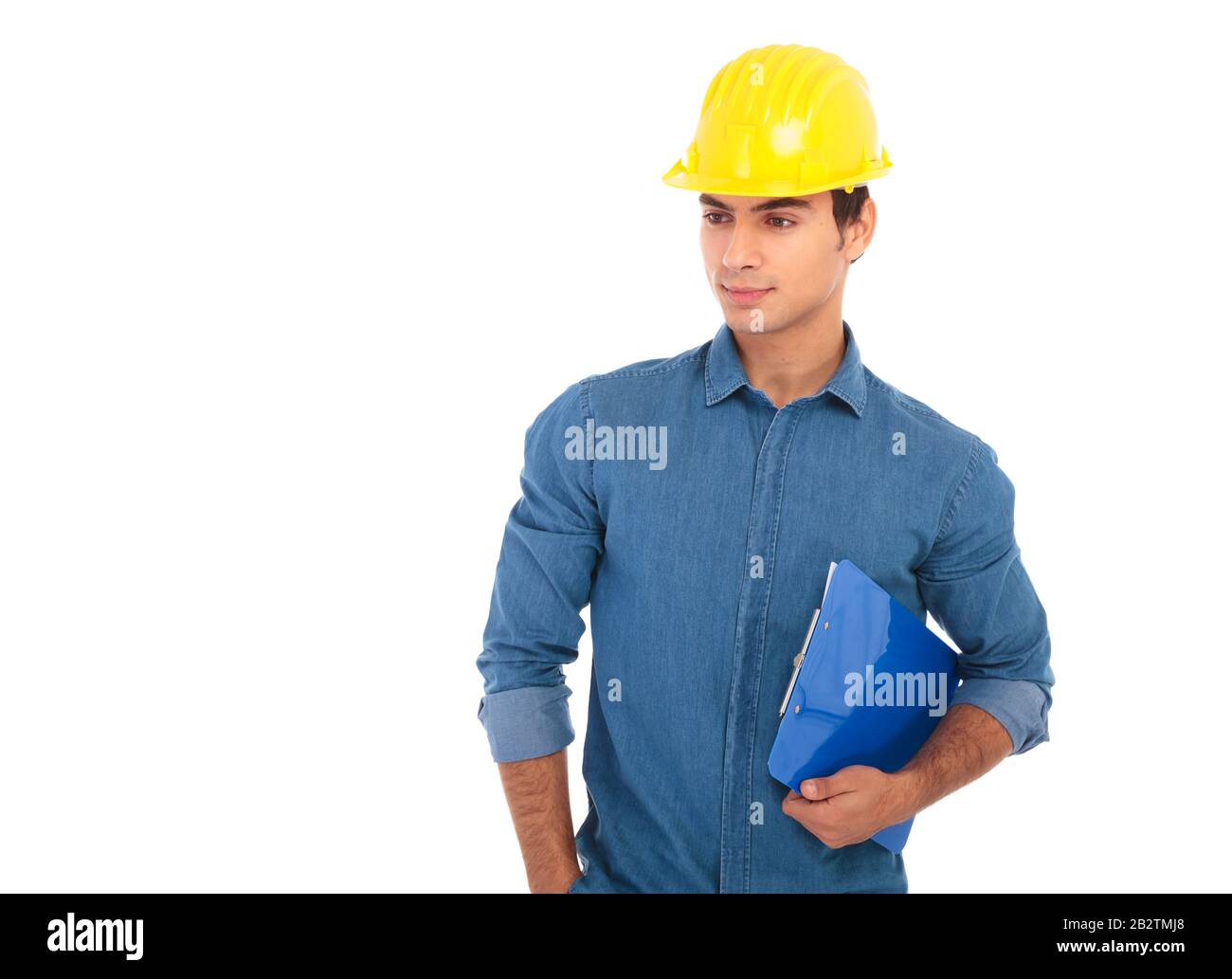 construction engineering student holding notepad and looks to side on ...