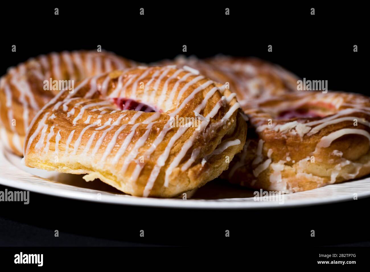 Pastry close up Danish baked goods on a plate. Breakfast food freshly ...