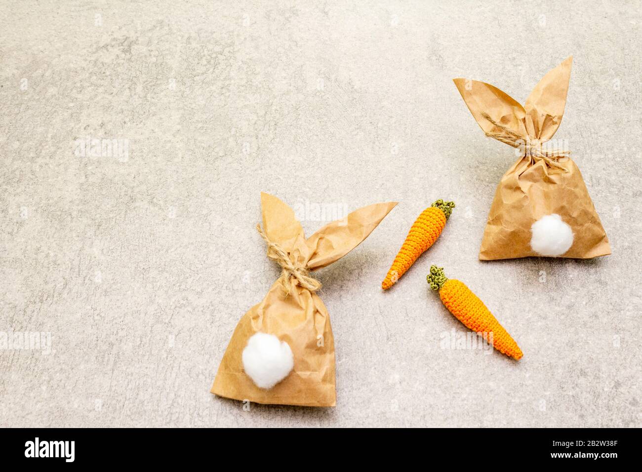 Easter bunny (rabbit) paper gift wrapping with knitted carrots idea ...