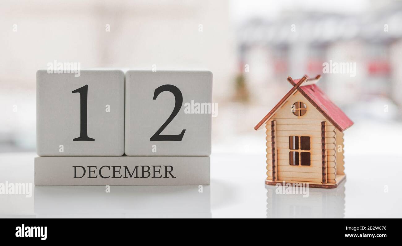 December calendar and toy home. Day 12 of month. Card message for print ...