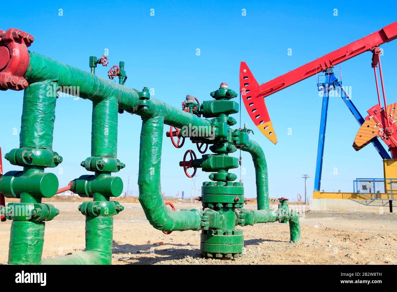 Oil field scene, Oil pipeline and pumping unit Stock Photo - Alamy