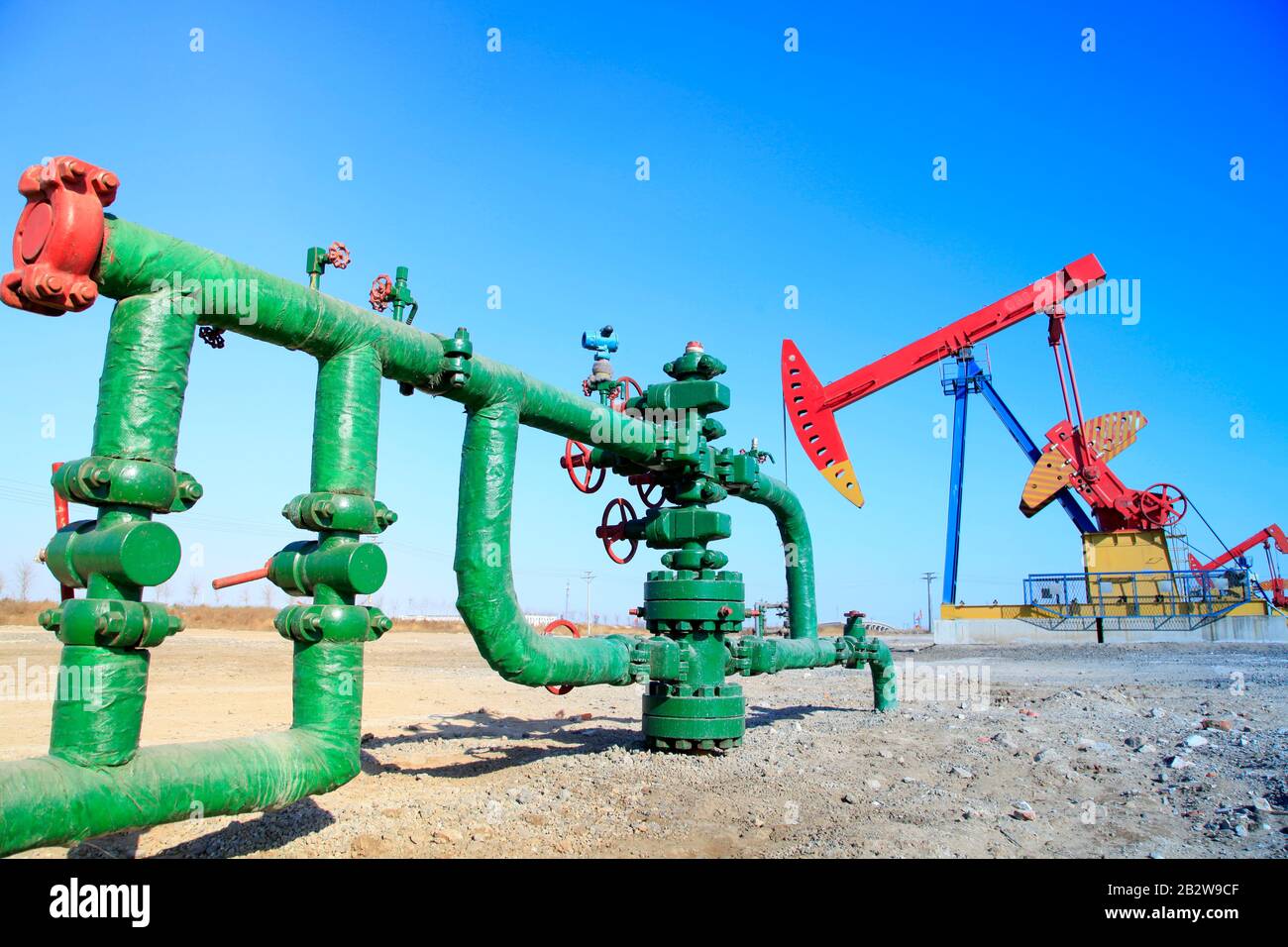 Oil field scene, Oil pipeline and pumping unit Stock Photo - Alamy