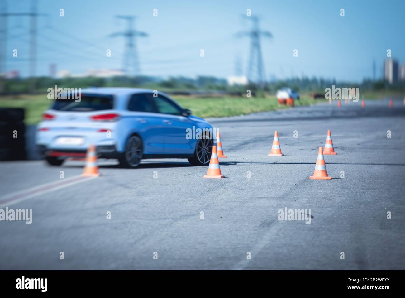 View of autodrome race circuit racetrack with a line of cars driving ...