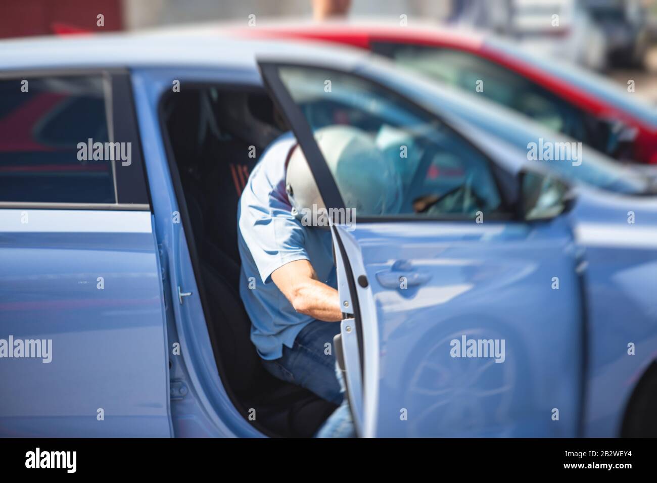 View of autodrome race circuit racetrack with a line of cars driving ...