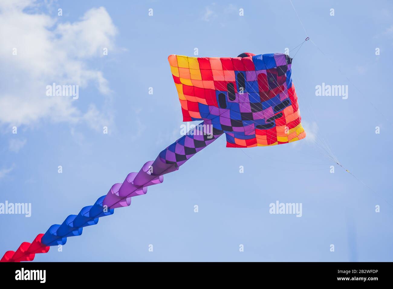 A lot of beautiful different colourful kites flying in the sky during ...