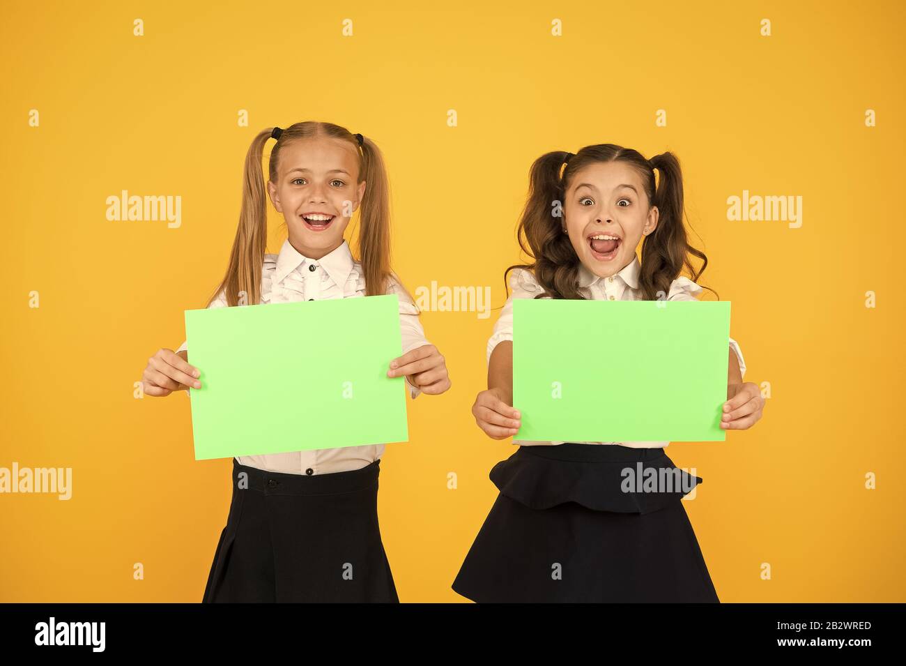 Genius advertising and marketing. Happy genius children holding blank ...