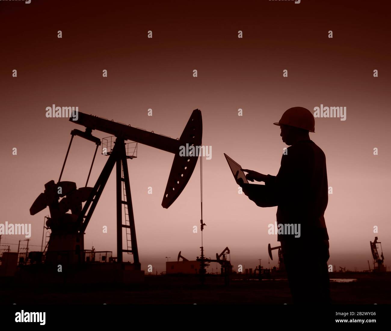 oil field, the oil workers are working Stock Photo - Alamy