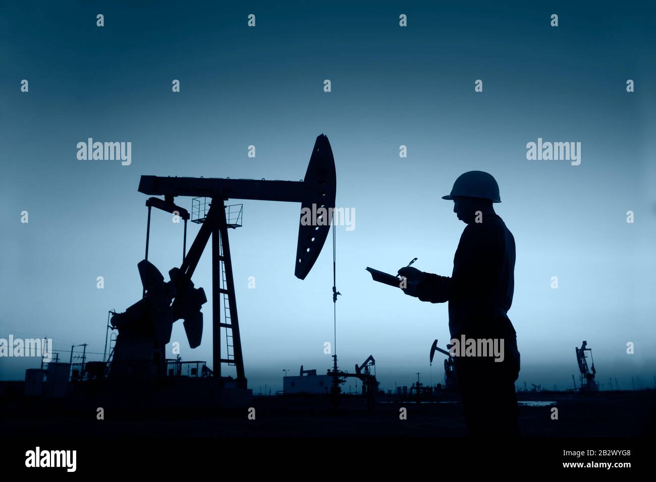 oil field, the oil workers are working Stock Photo - Alamy