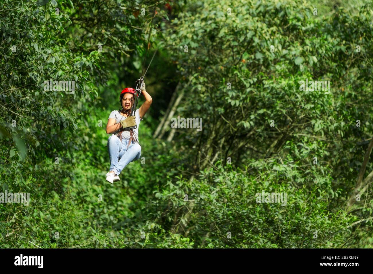 Woman on zip wire hi-res stock photography and images - Alamy