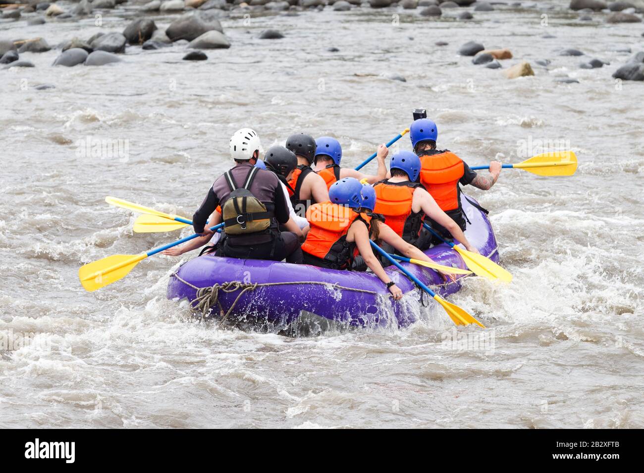 Whitewater Rafting Boat With Tourist Shot From The Back Stock Photo - Alamy