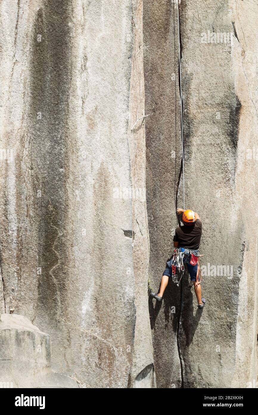 Rock Climbing On A Perfect Upright Ship Rock Stock Photo - Alamy