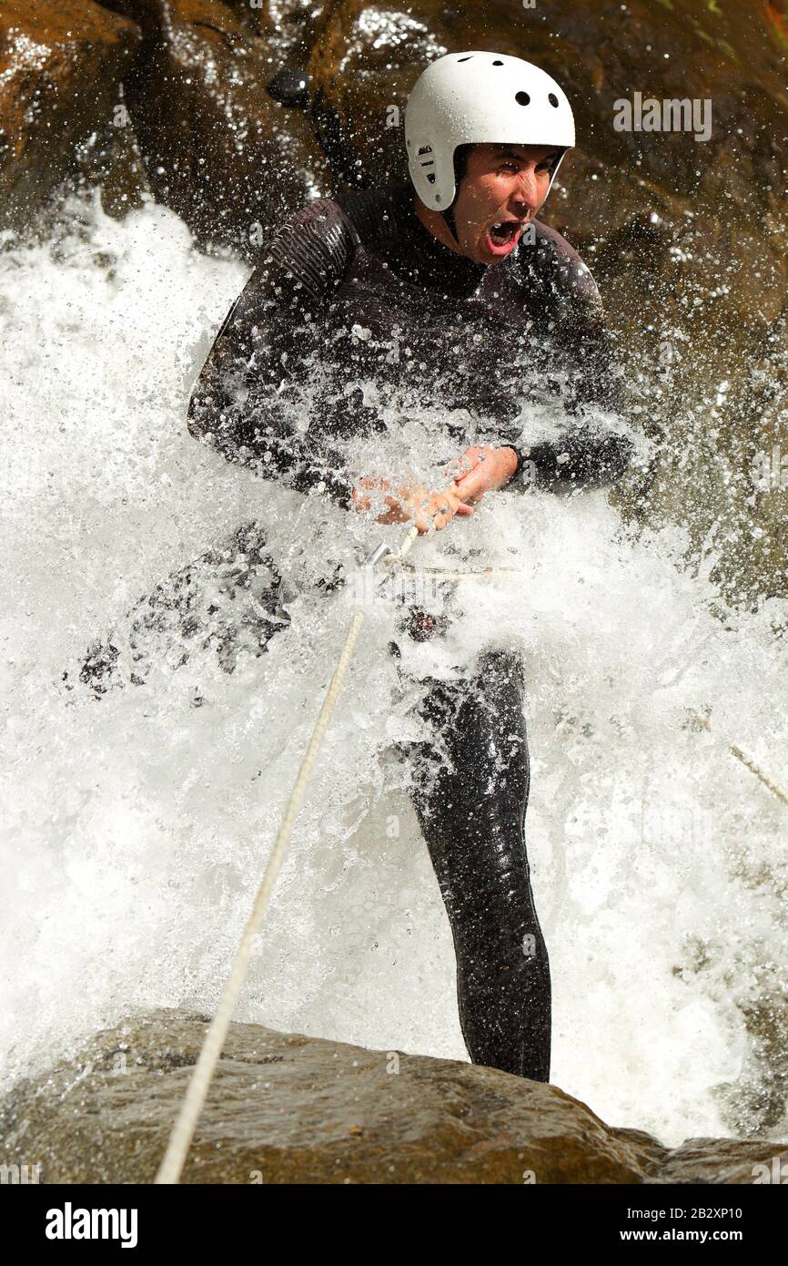 Adult Man Descending Inside A Waterfall Shoot From The Fluid Straight ...