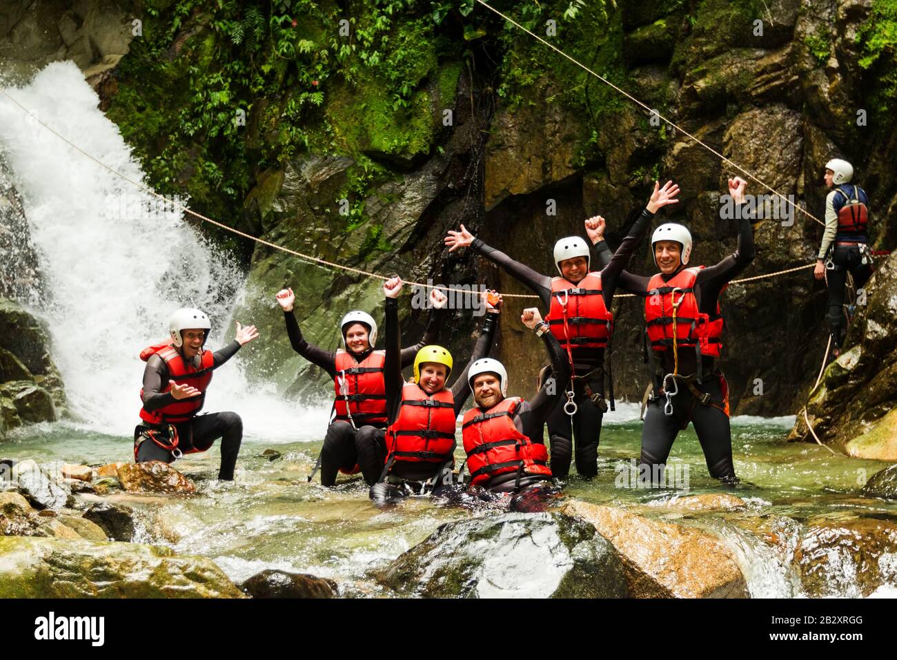 Partnership Of Human Having Fun During A Canyoning Expedition In ...