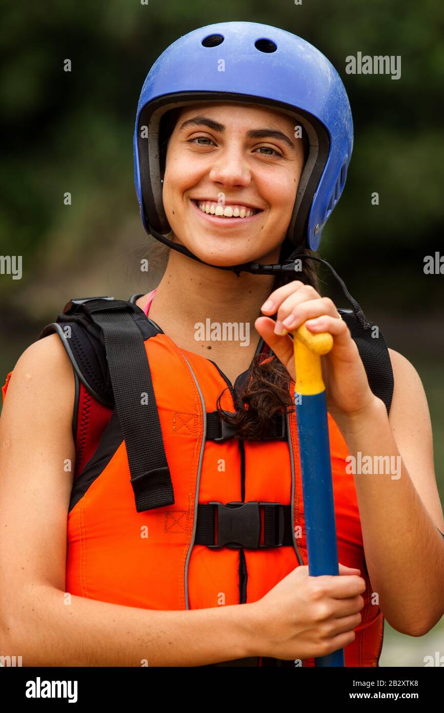 Portrait Of Smiling Young Lady Wearing White Water Rafting Equipment ...