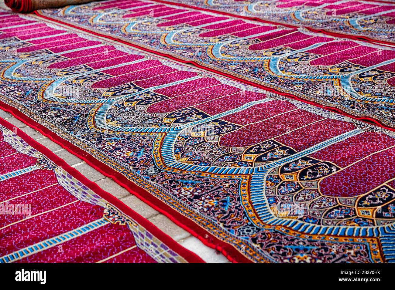 Mosque prayer carpets Stock Photo - Alamy