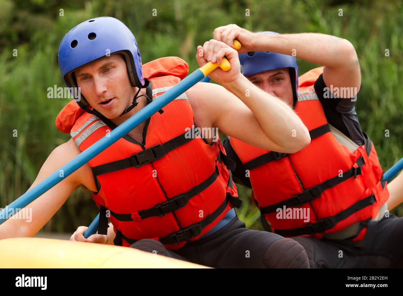 Group Of Young Athletes Training For Whitewater Rafting Stock Photo - Alamy